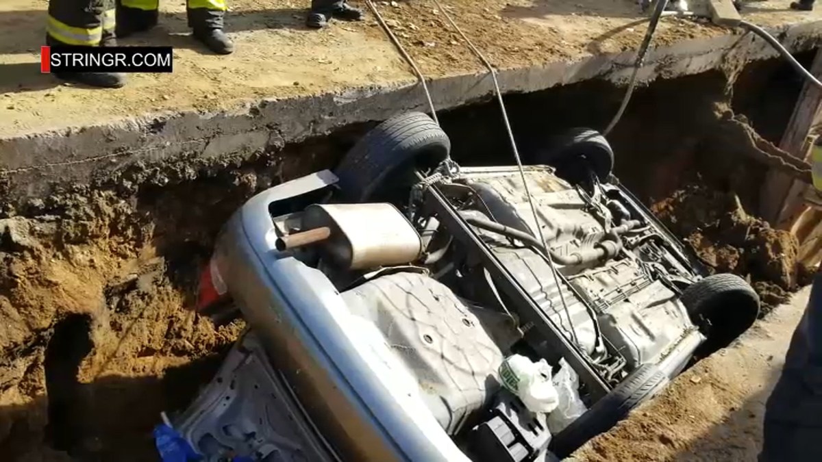 89-Year-Old Drives Through Construction Barrier, Flips Into Ditch: FDNY ...