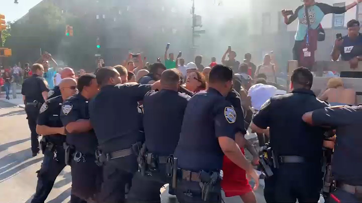 Fight Breaks Out Between Cops and Residents as Firefighters Battle ...