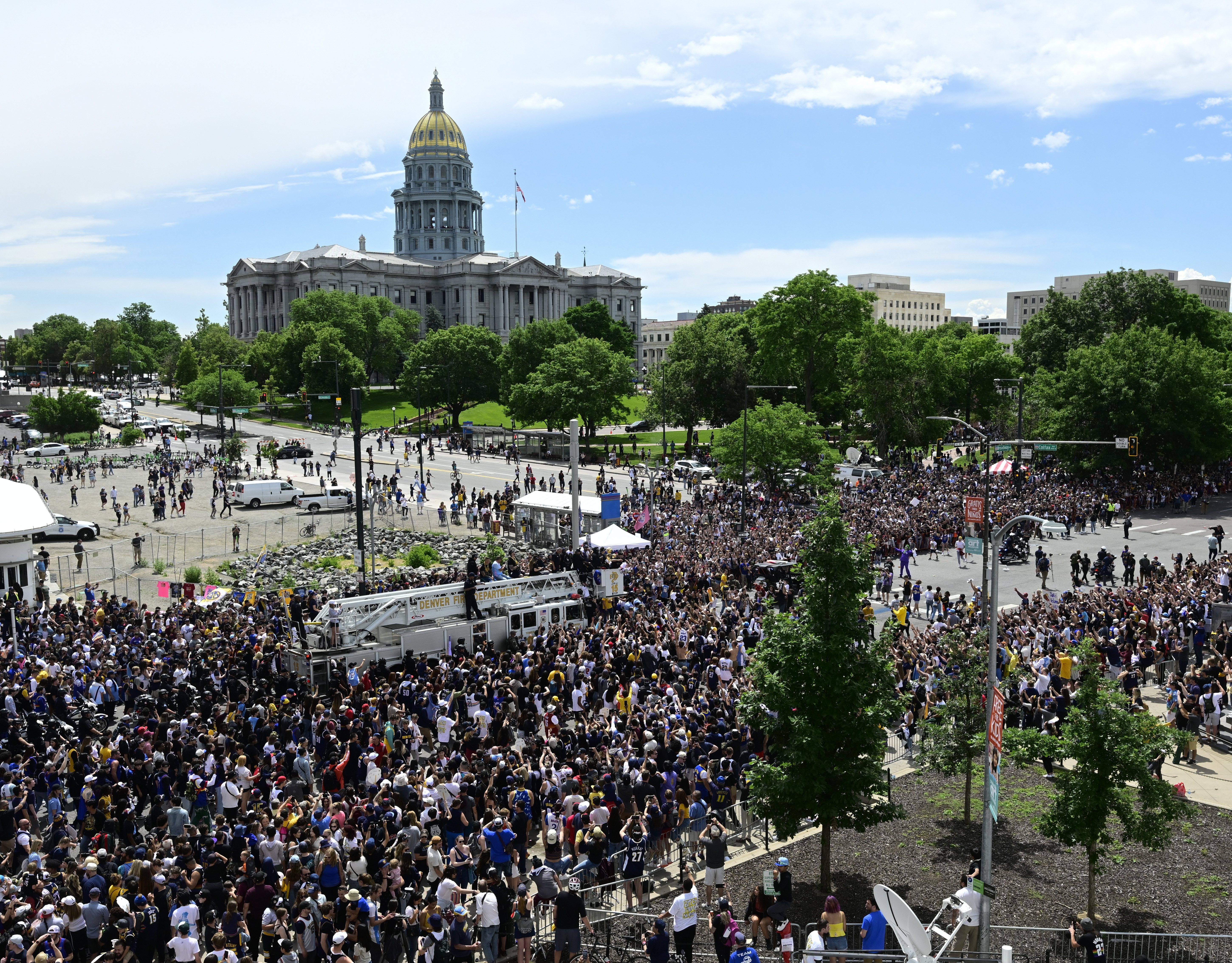 Denver officer struck by firetruck, injured after crash at Nuggets ...