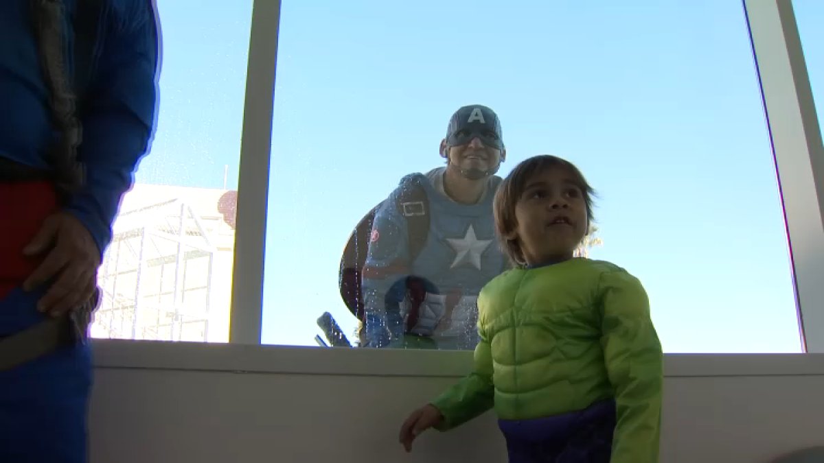 Window-washing superheroes bring smiles to Rady Children’s Hospital on ...