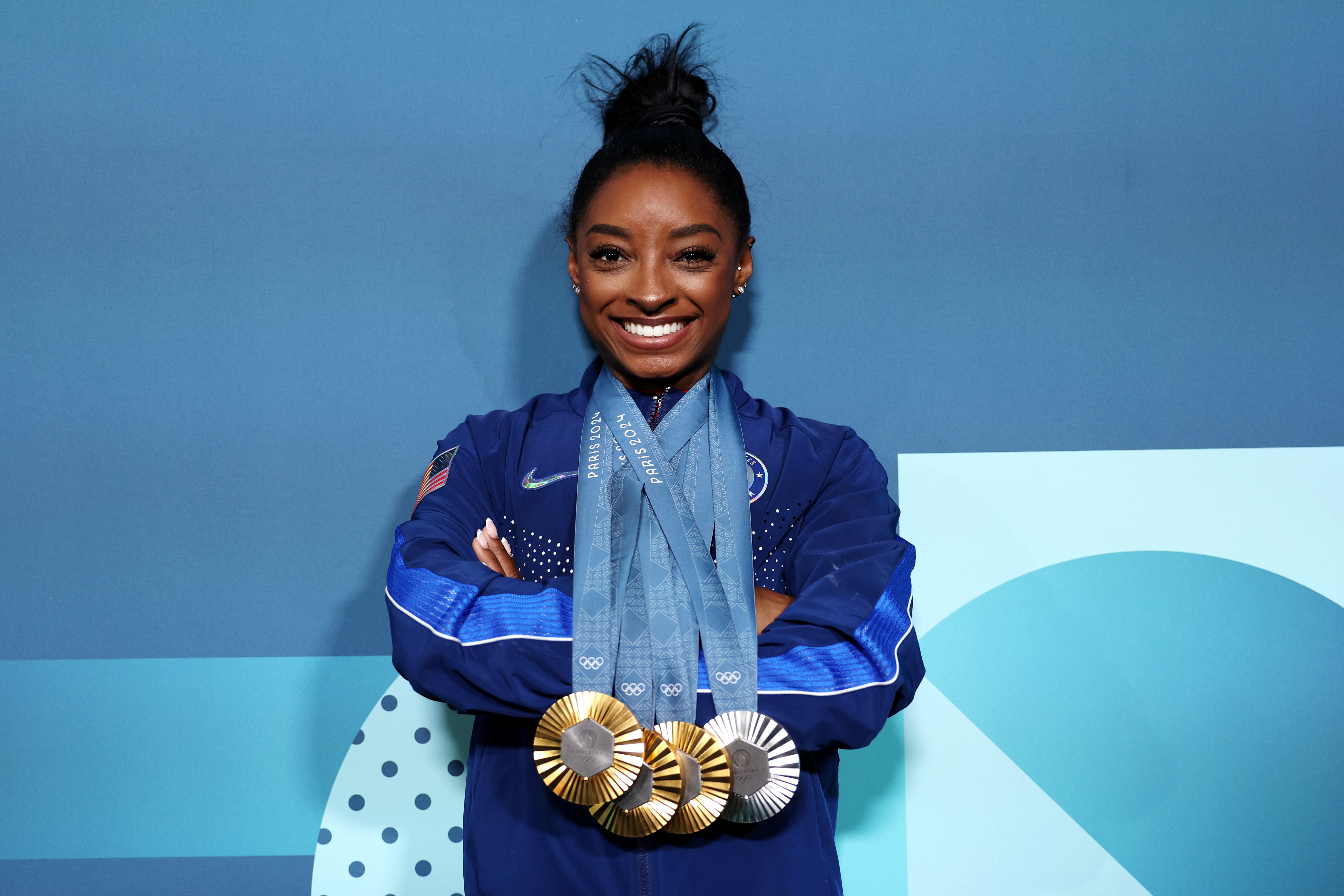 Simone Biles poses with her 11 Olympic medals in new photos – NBC New York