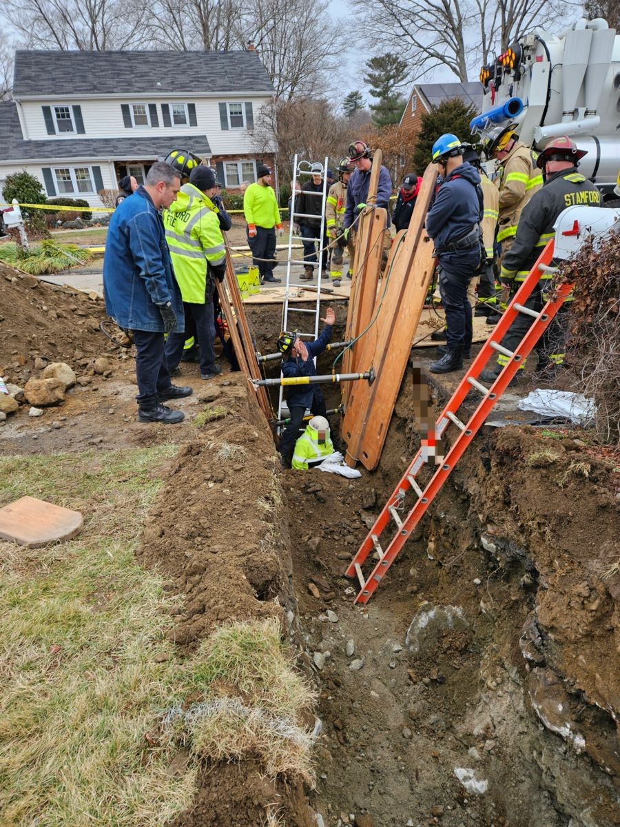 Firefighters free worker buried in trench collapse in Stamford, Conn ...