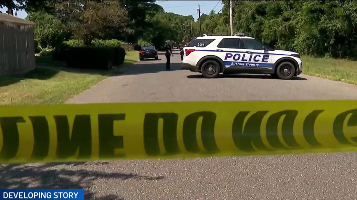 Long Island police officer shot while investigating body found in woods ...