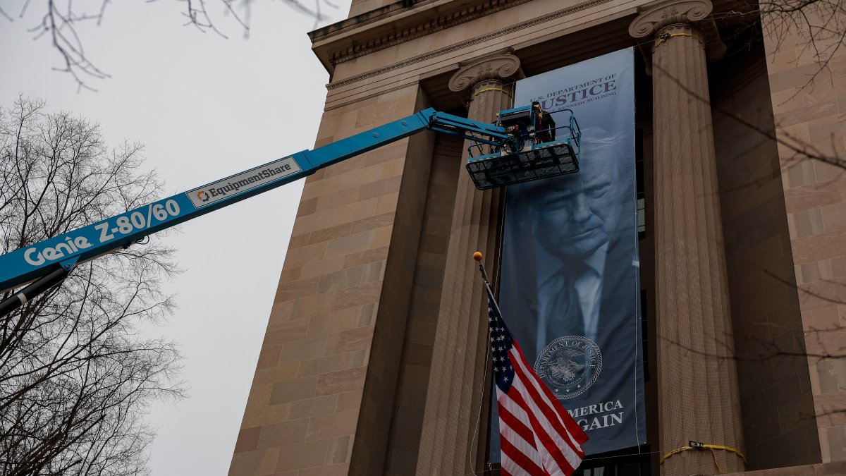 Large banner featuring Trump’s face hung up at Justice Department – NBC ...